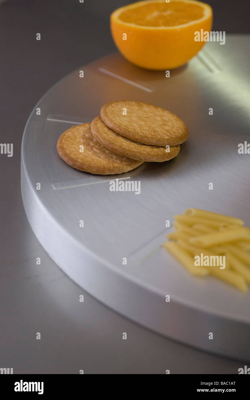 clock food control- pasta, biscuits, orange Stock Photo - Alamy