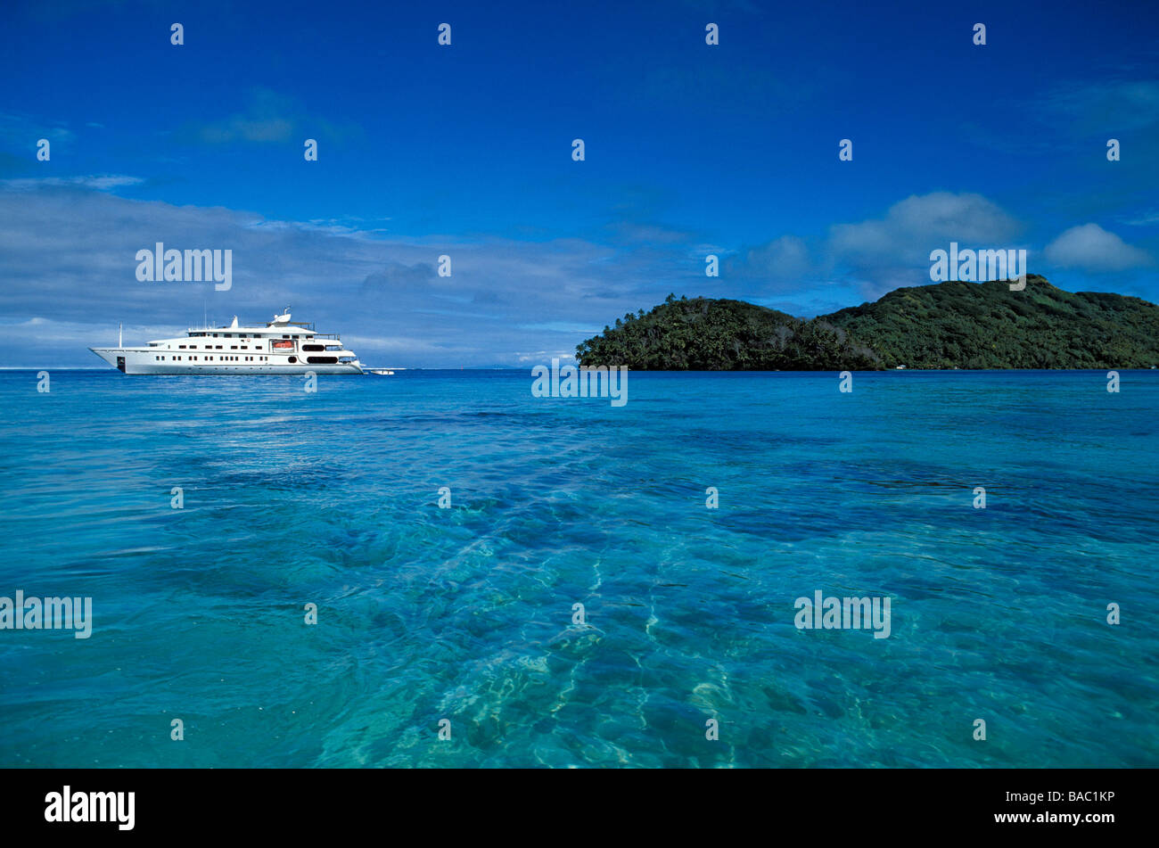 France, French Polynesia, Tia Moana Yacht sailing off of the island of ...