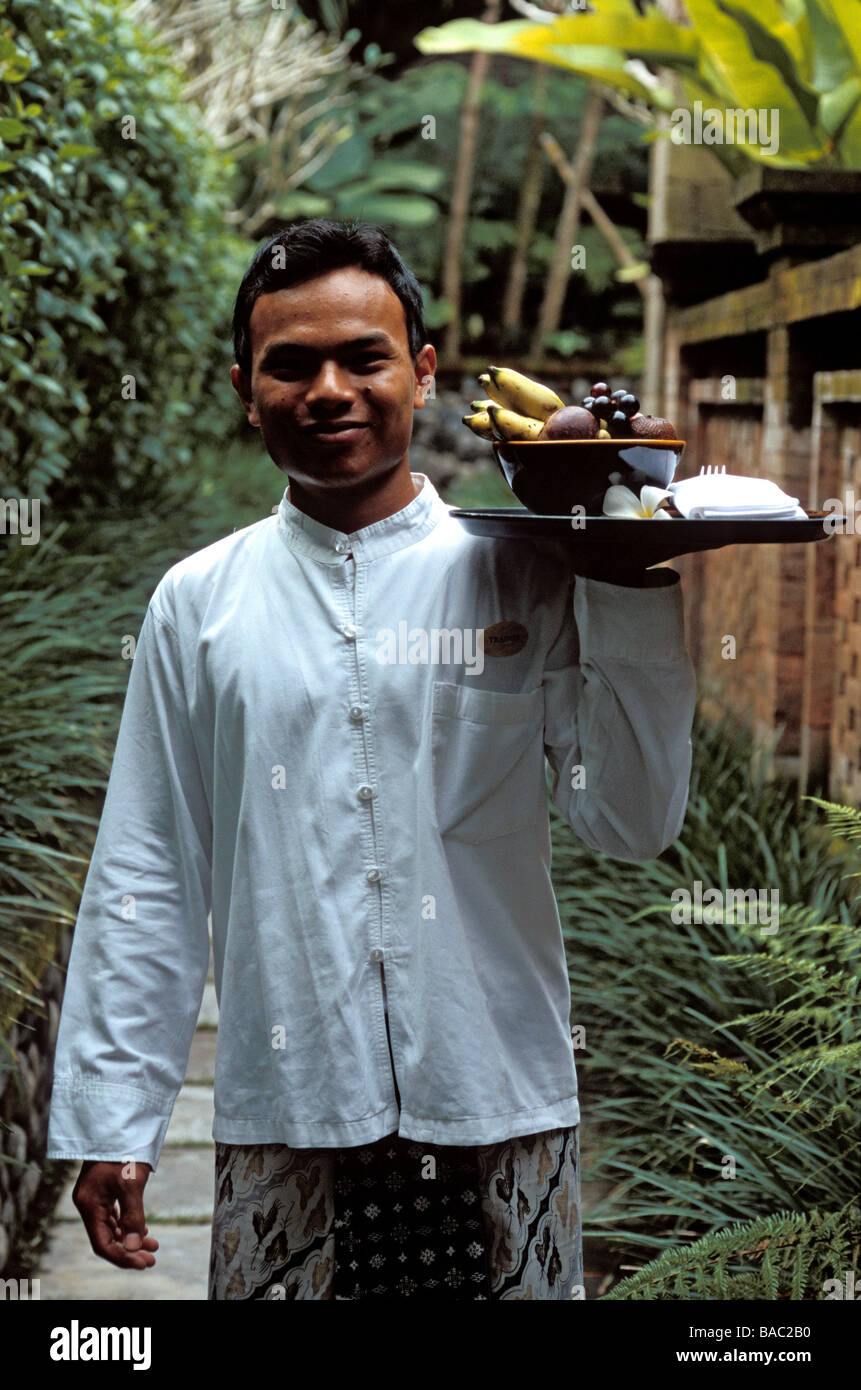 Indonesia, Bali, waiter serving fresh fruit at Uma Ubud Hotel Resort ...