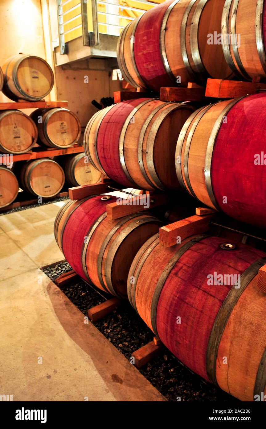 Stacked oak wine barrels in winery cellar Stock Photo - Alamy