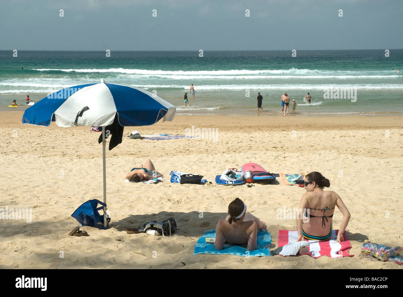 Sunbathers relaxing on Manly Beach, New South Wales, Australia Stock ...