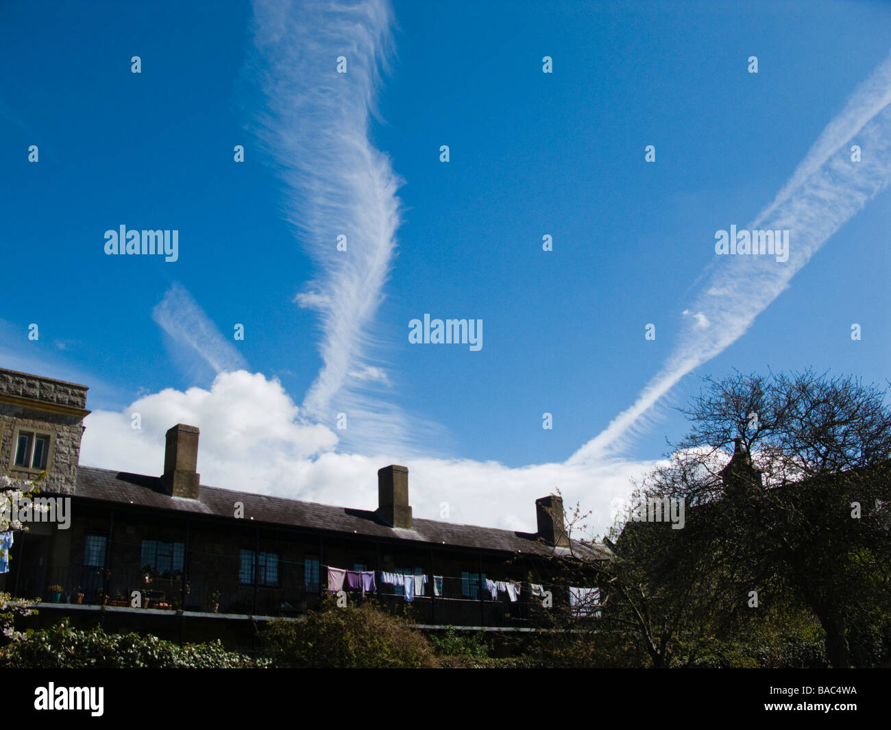 Blue sky, clouds and vapour trails over Ledbury Stock Photo - Alamy