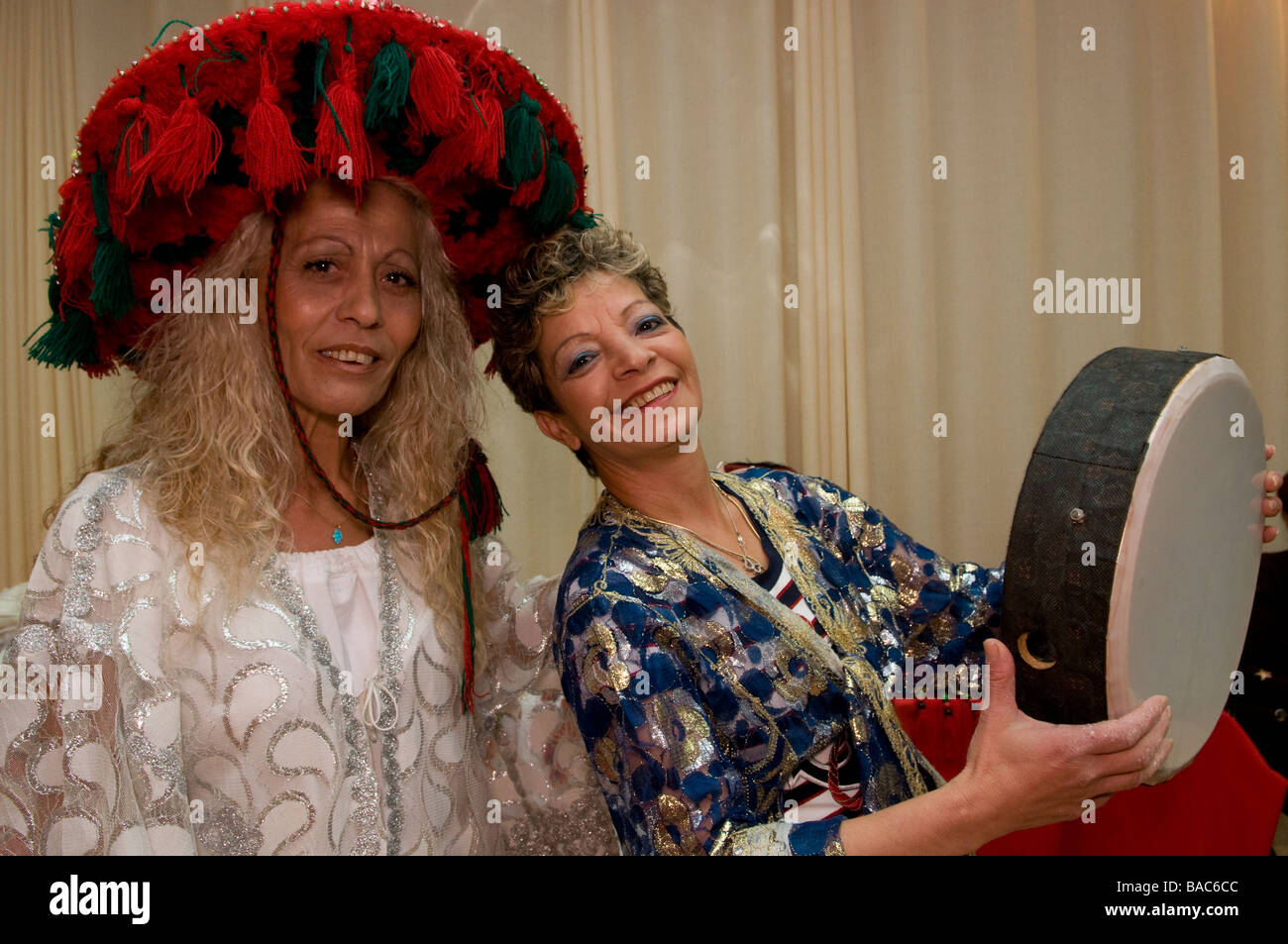 Morroccan Jewish women wearing traditional garment during the Mimunah ...