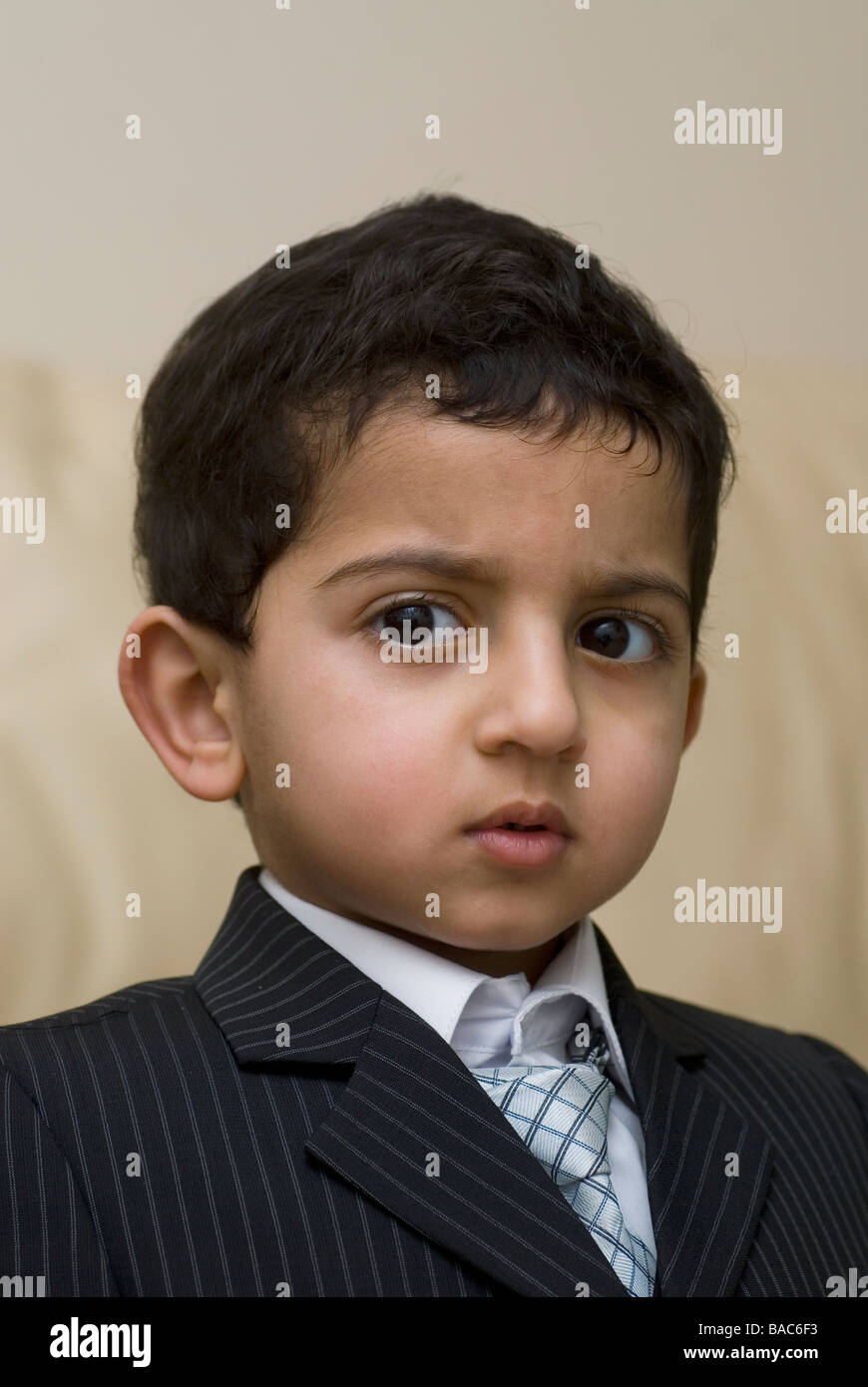 Serious young boy wearing suit hi-res stock photography and images - Alamy