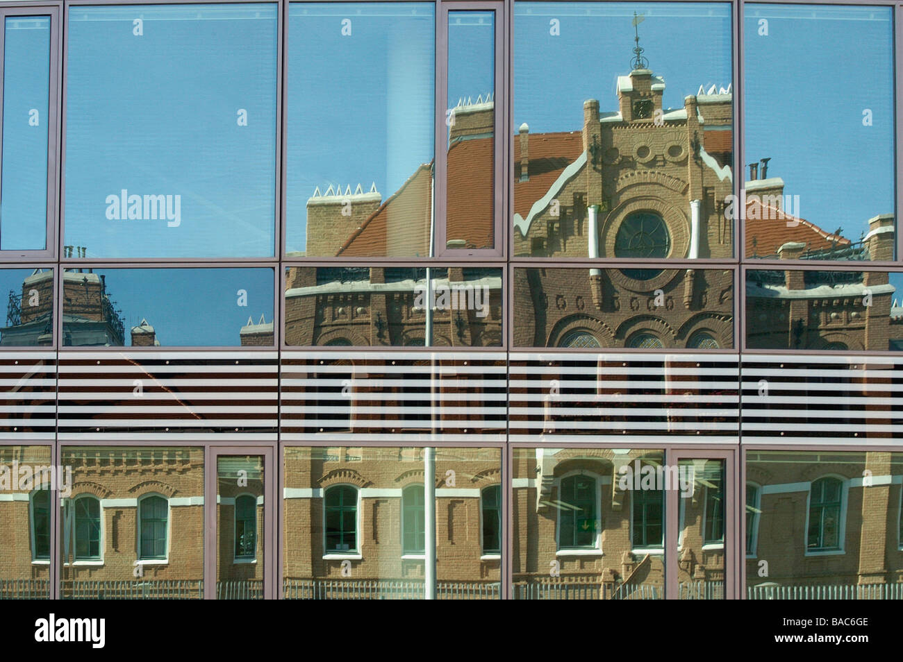 Reflection in a glass facade Stock Photo - Alamy