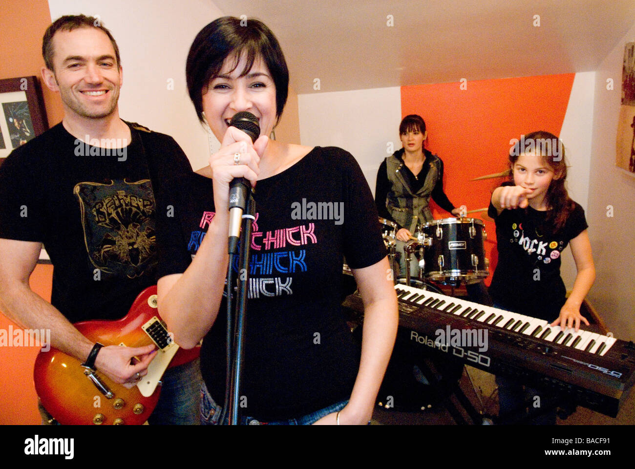 Family performing in a musical band Stock Photo - Alamy