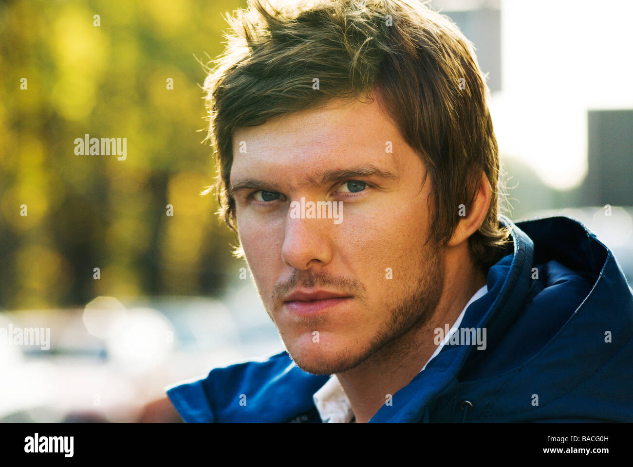 Portrait of a young man thinking Stock Photo - Alamy