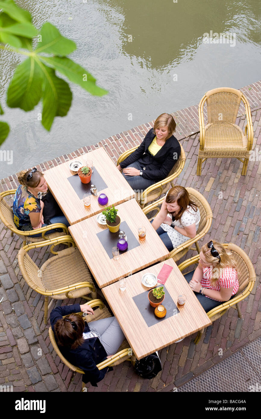 Netherlands, Southern Holland Province, Utrecht, girls on a terrace at ...