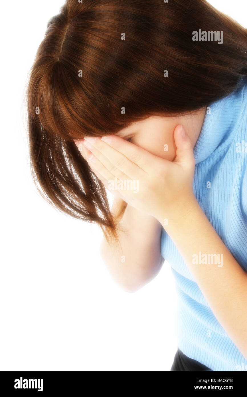 Young woman covering her face with her hands Stock Photo - Alamy
