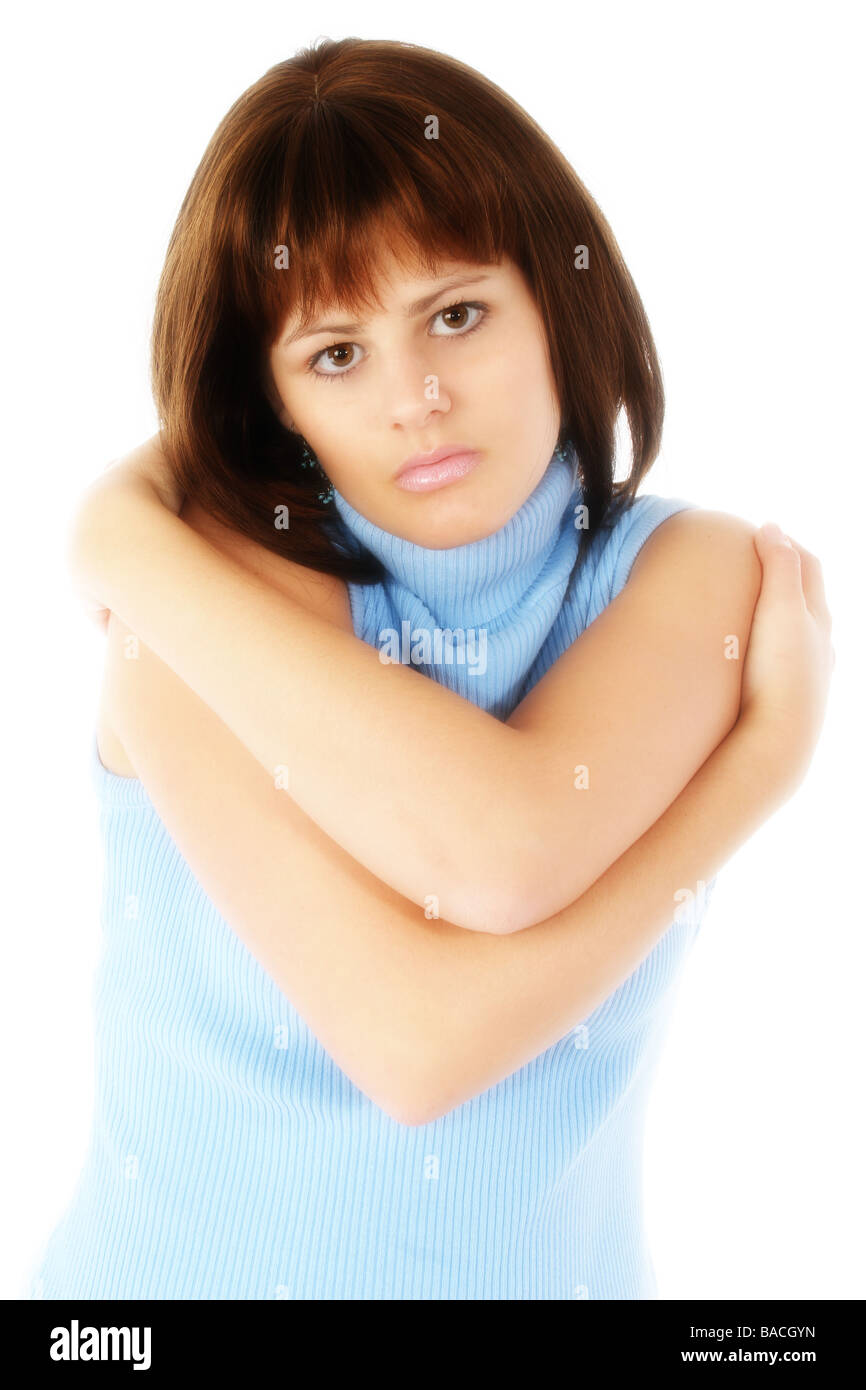 Young woman hugging herself Stock Photo - Alamy