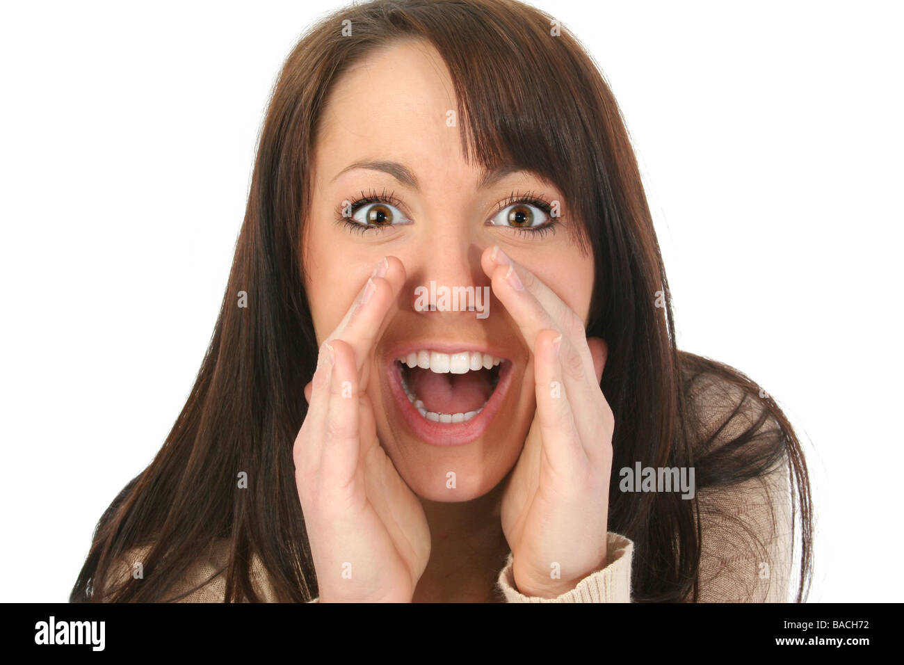 Portrait of a young woman calling with her hands near her mouth Stock ...