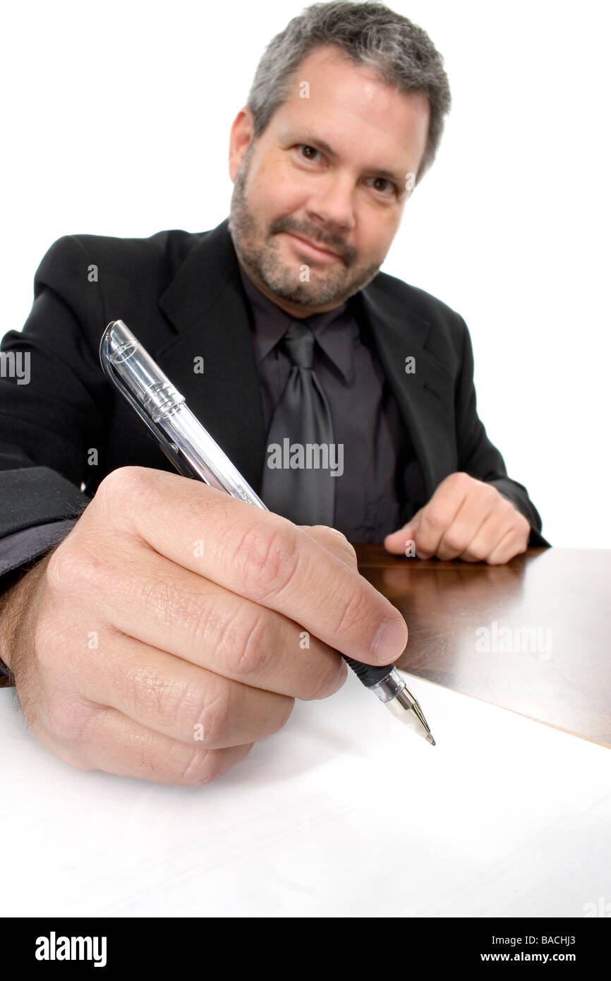 Portrait of a businessman writing on a sheet of paper Stock Photo - Alamy