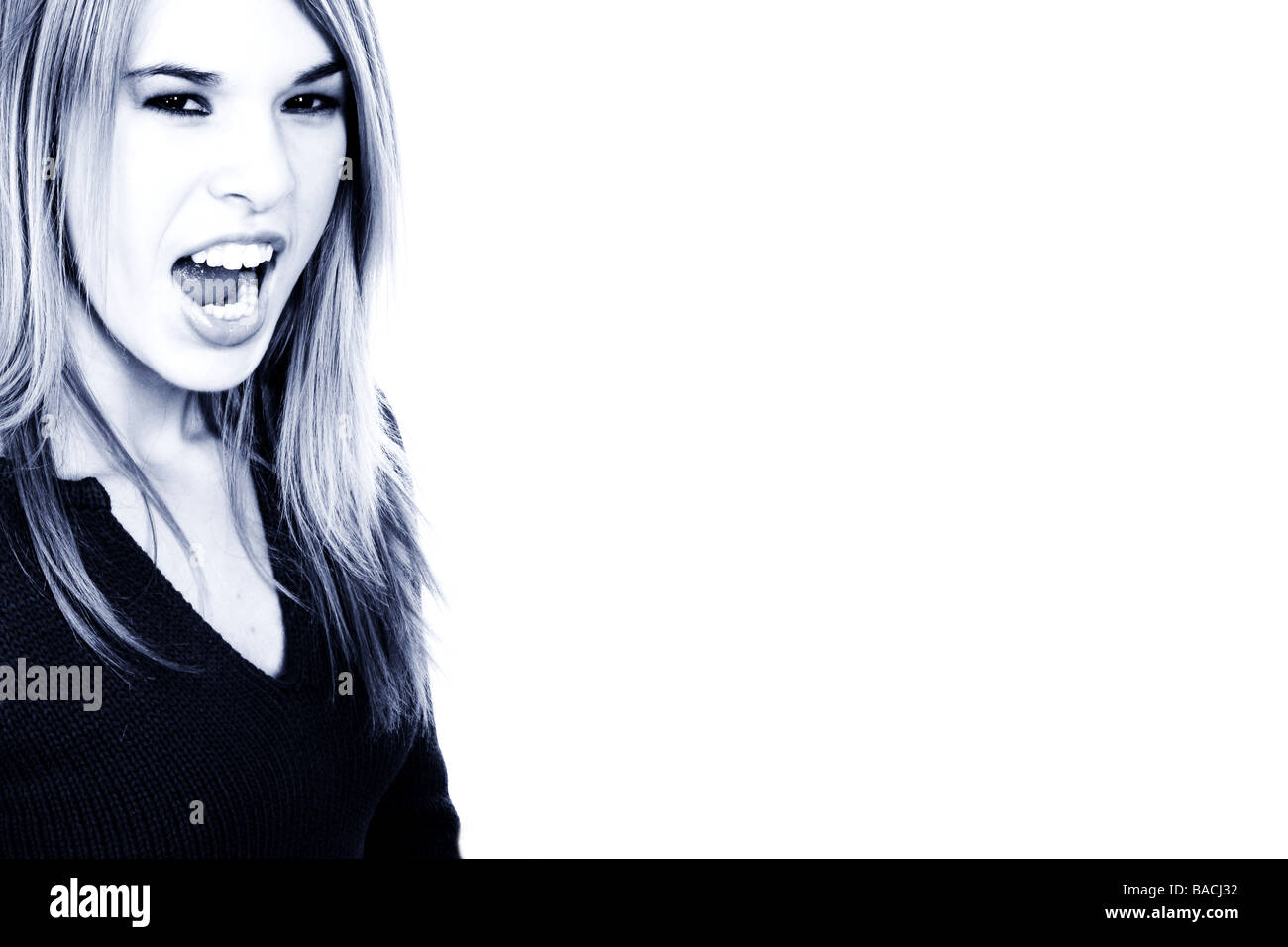 Portrait of a young woman shouting Stock Photo - Alamy