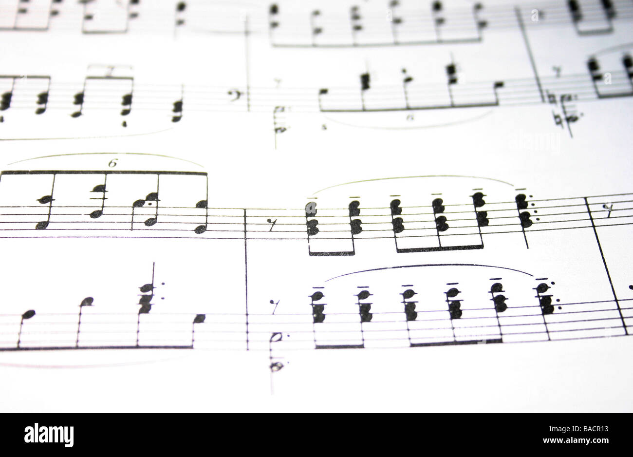 Music sheet with several notes going across the page Stock Photo - Alamy