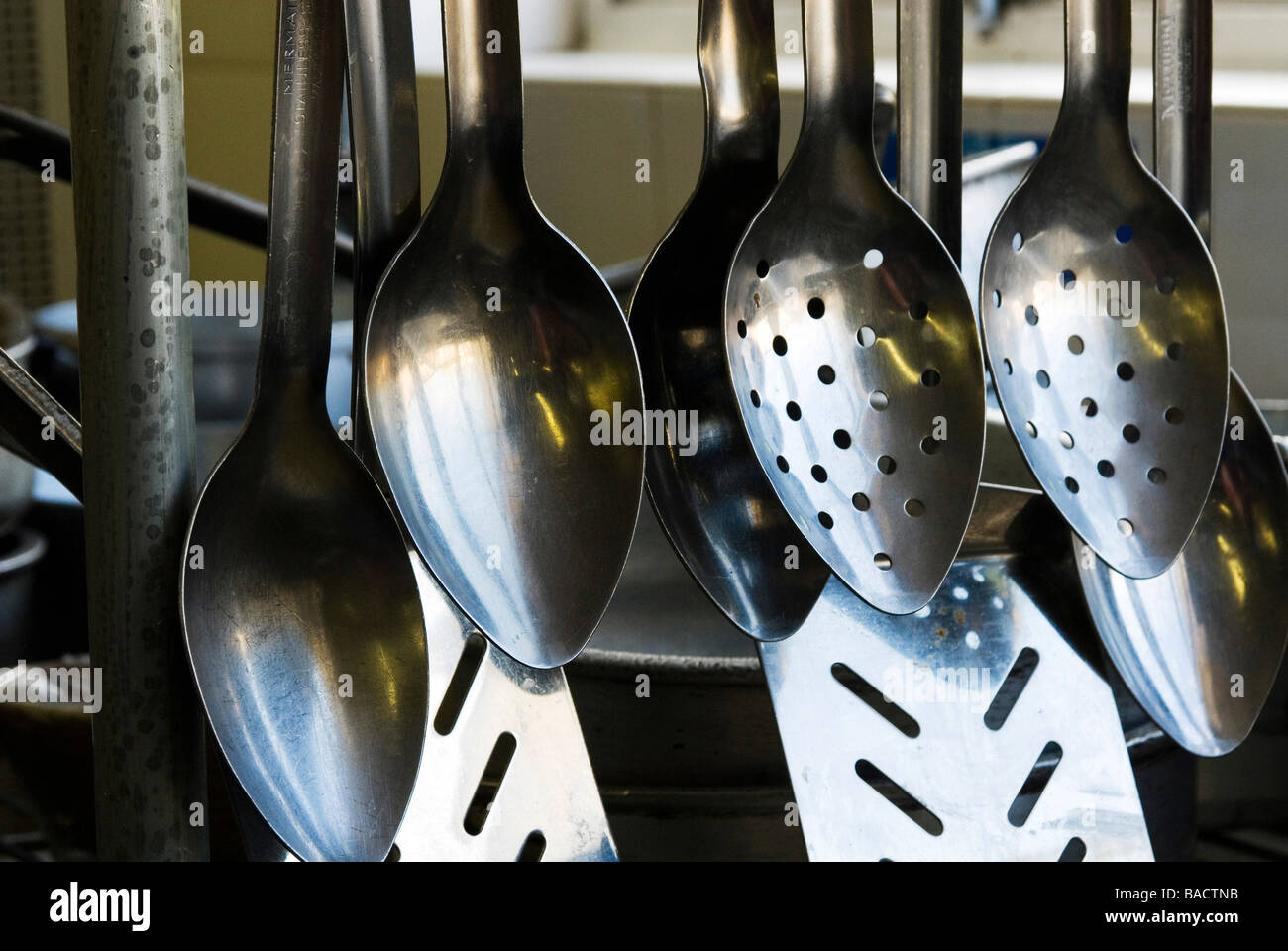 Close-up of kitchen utensils hanging in the kitchen Stock Photo - Alamy