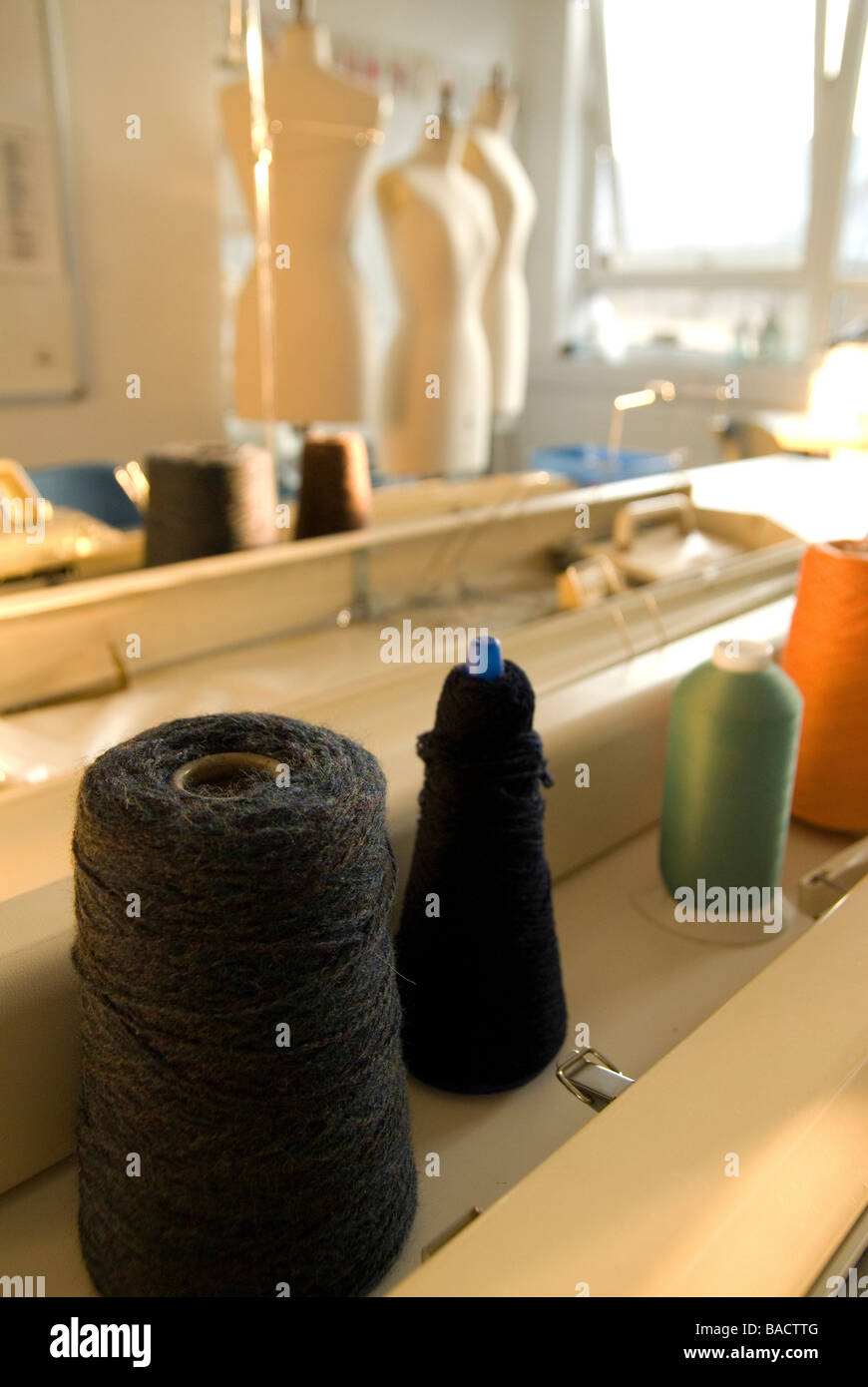 Reflection of thread spools and mannequins in a mirror Stock Photo - Alamy