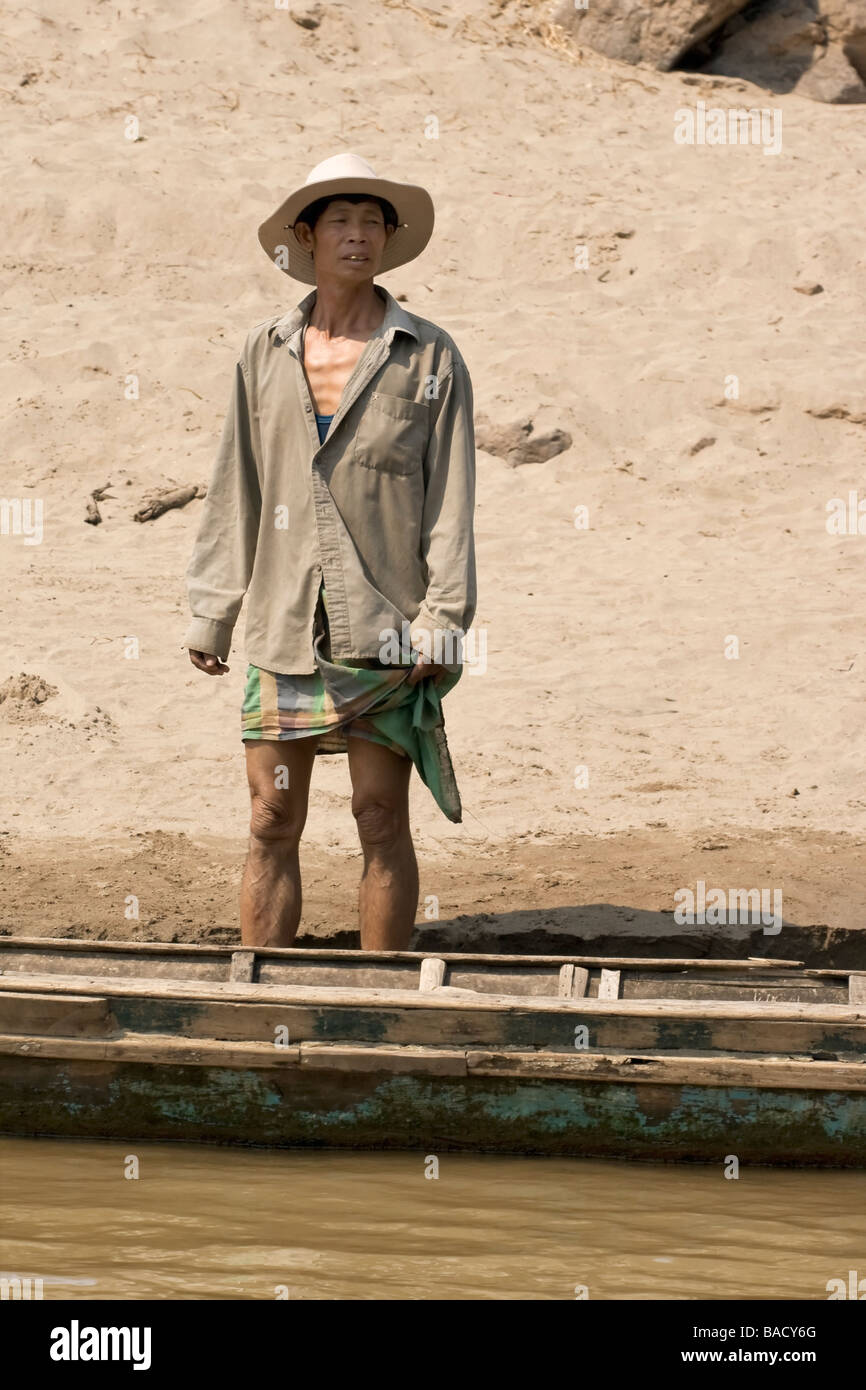 River boat and boatman on the Mekong river in Laos Stock Photo - Alamy