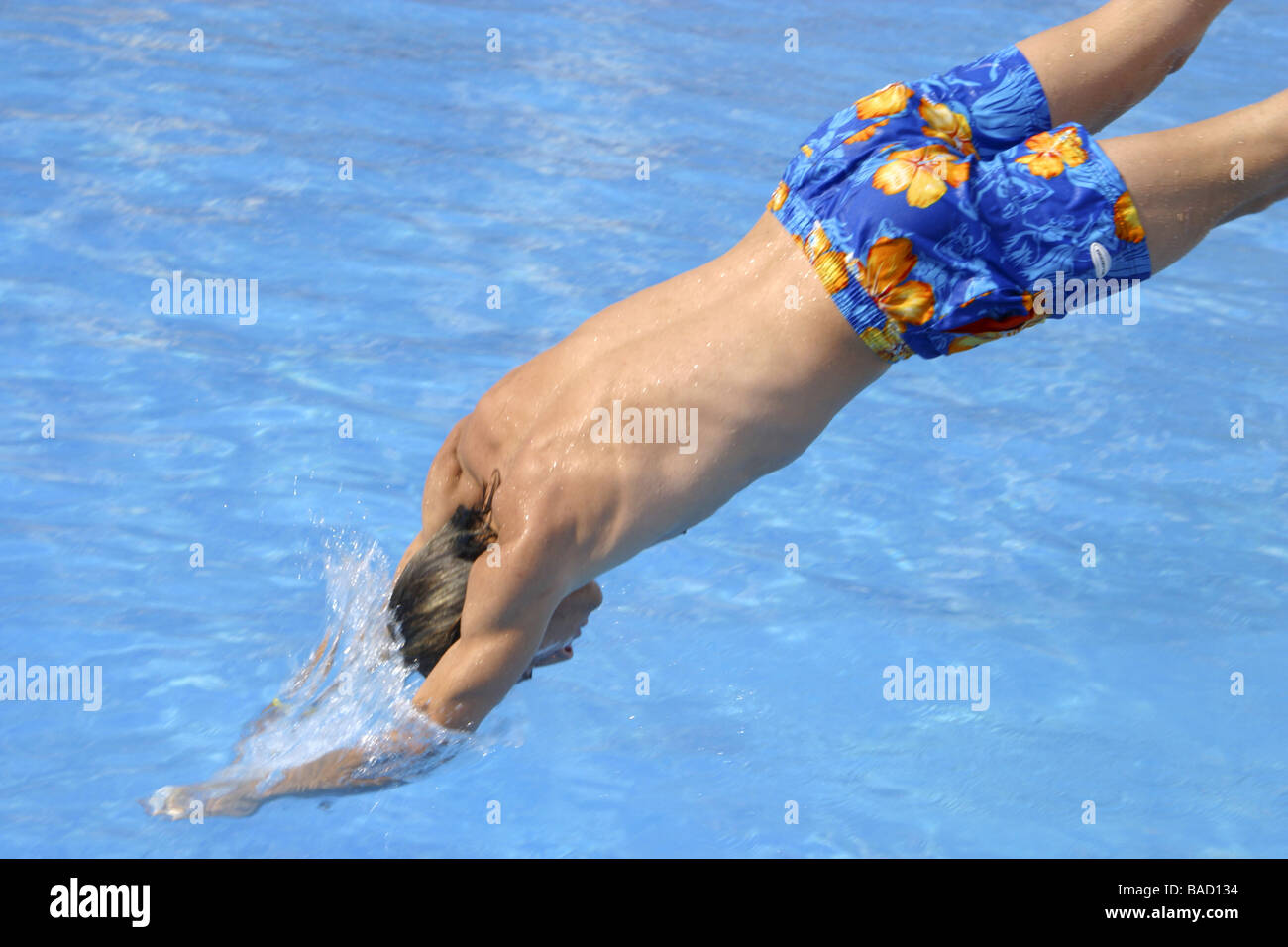 Diving into pool Stock Photo - Alamy