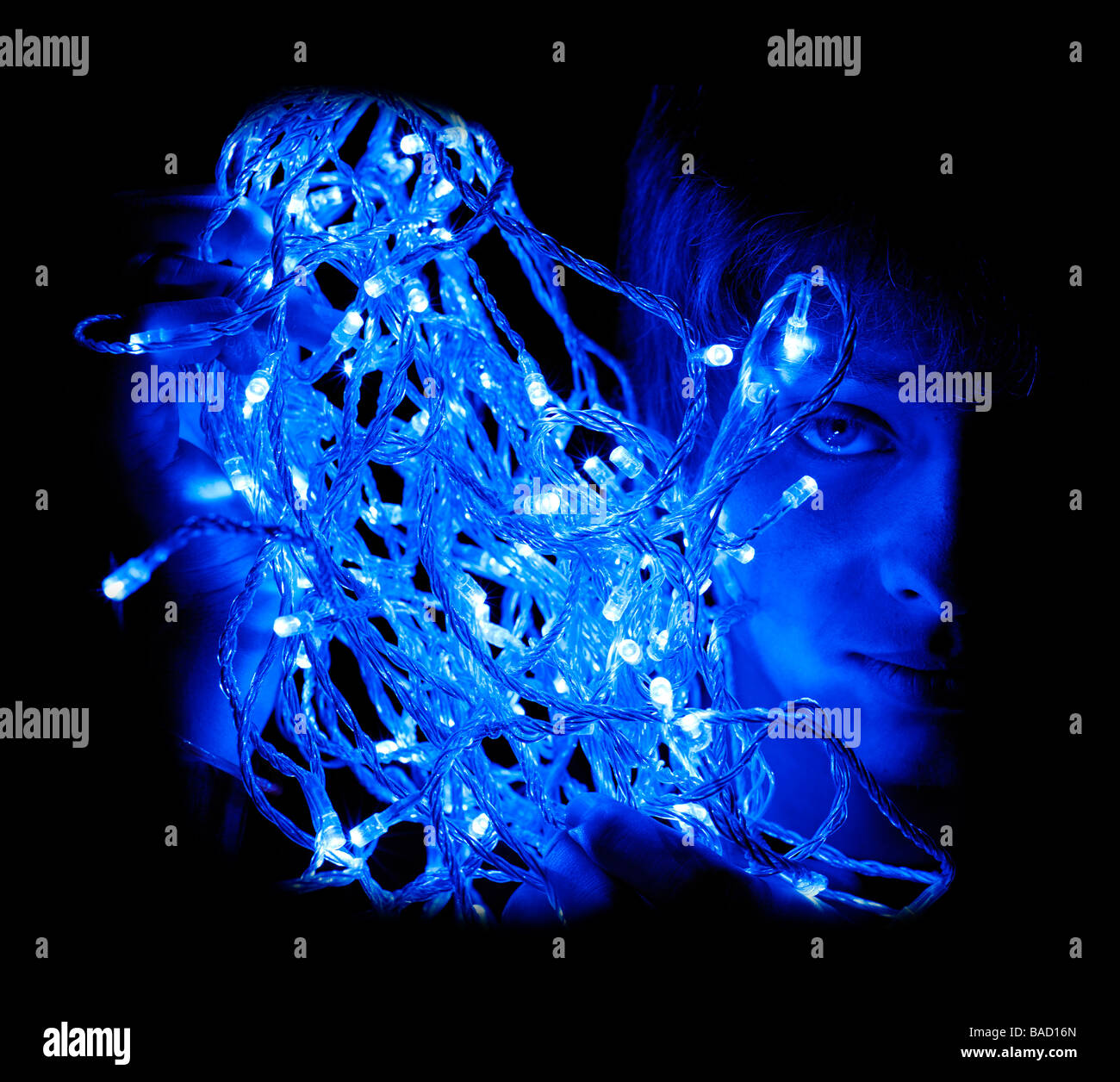 Boy with blue lights Stock Photo - Alamy