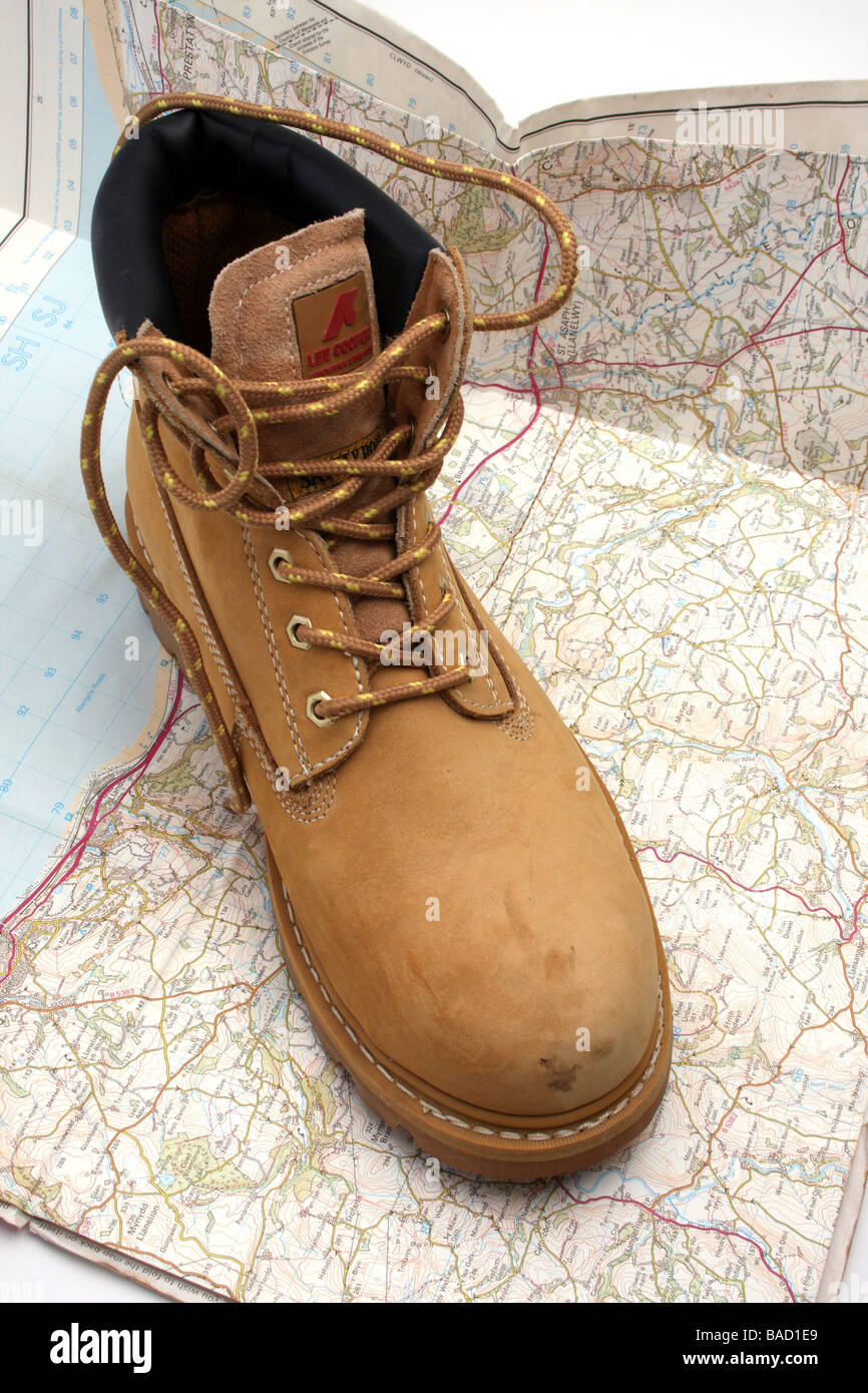 studio shot of a boot on an open map Stock Photo - Alamy