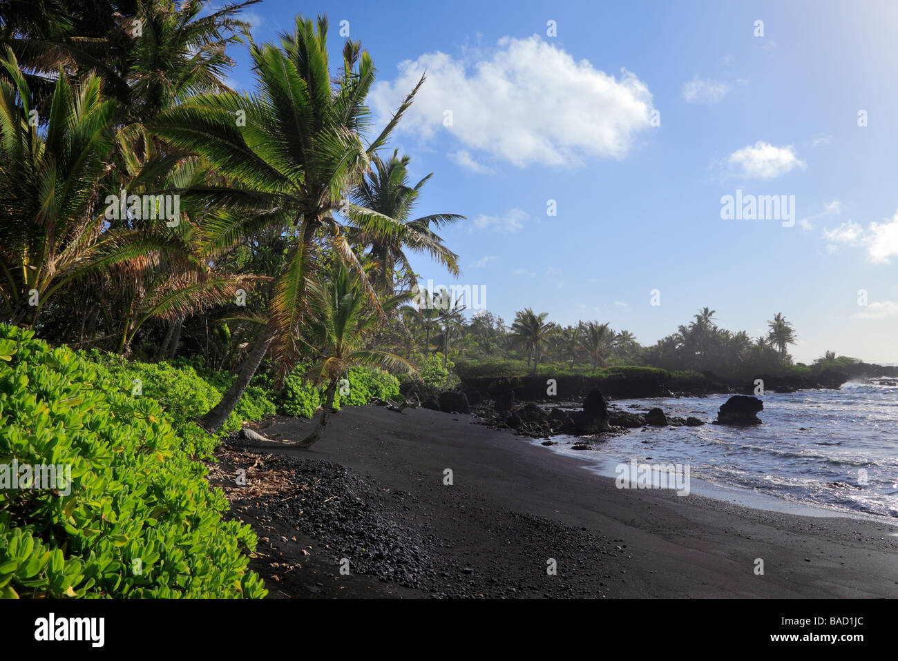 Black sand beach in Hana Bay on the northeast coast of Maui, in the ...