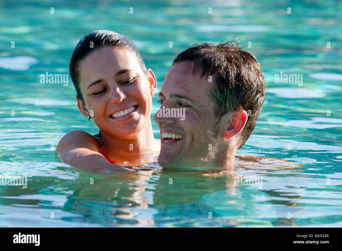 Couple having fun in swimming pool Stock Photo - Alamy