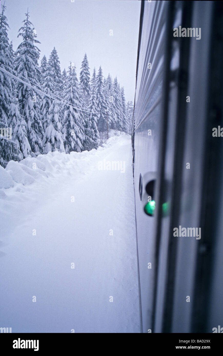 View outside Amtrak train window in winter wilderness Stock Photo - Alamy