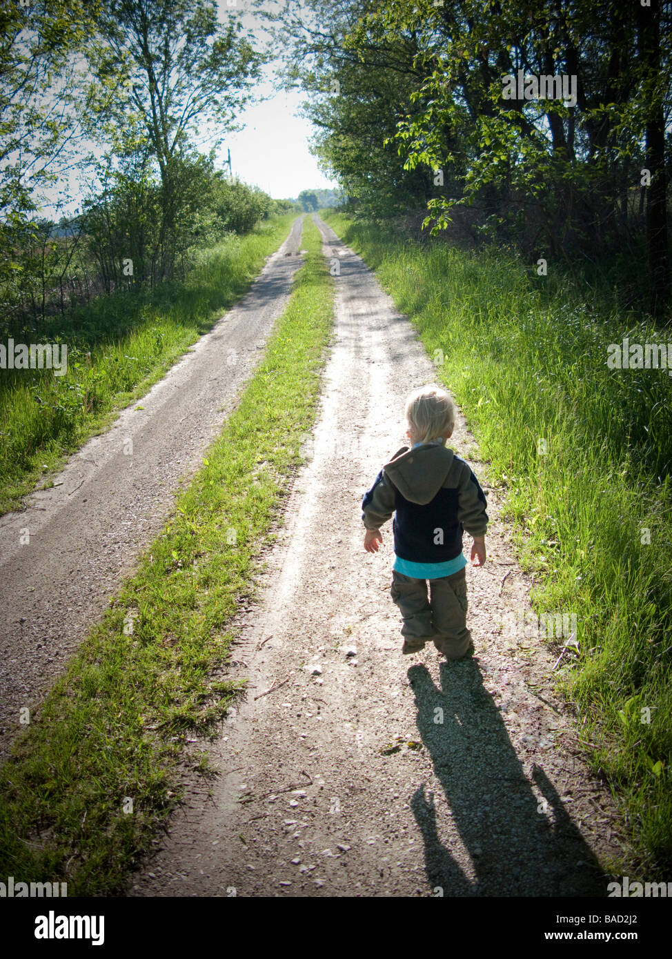 Two children walking along road hi-res stock photography and images - Alamy