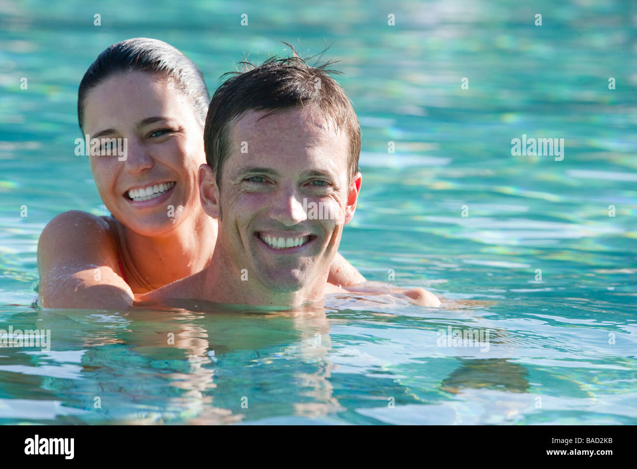 Couple in resort swimming pool Stock Photo - Alamy