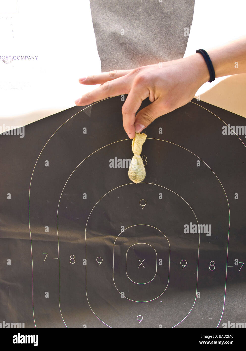 Non lethal bean bag projectile is held in front of target Stock Photo ...