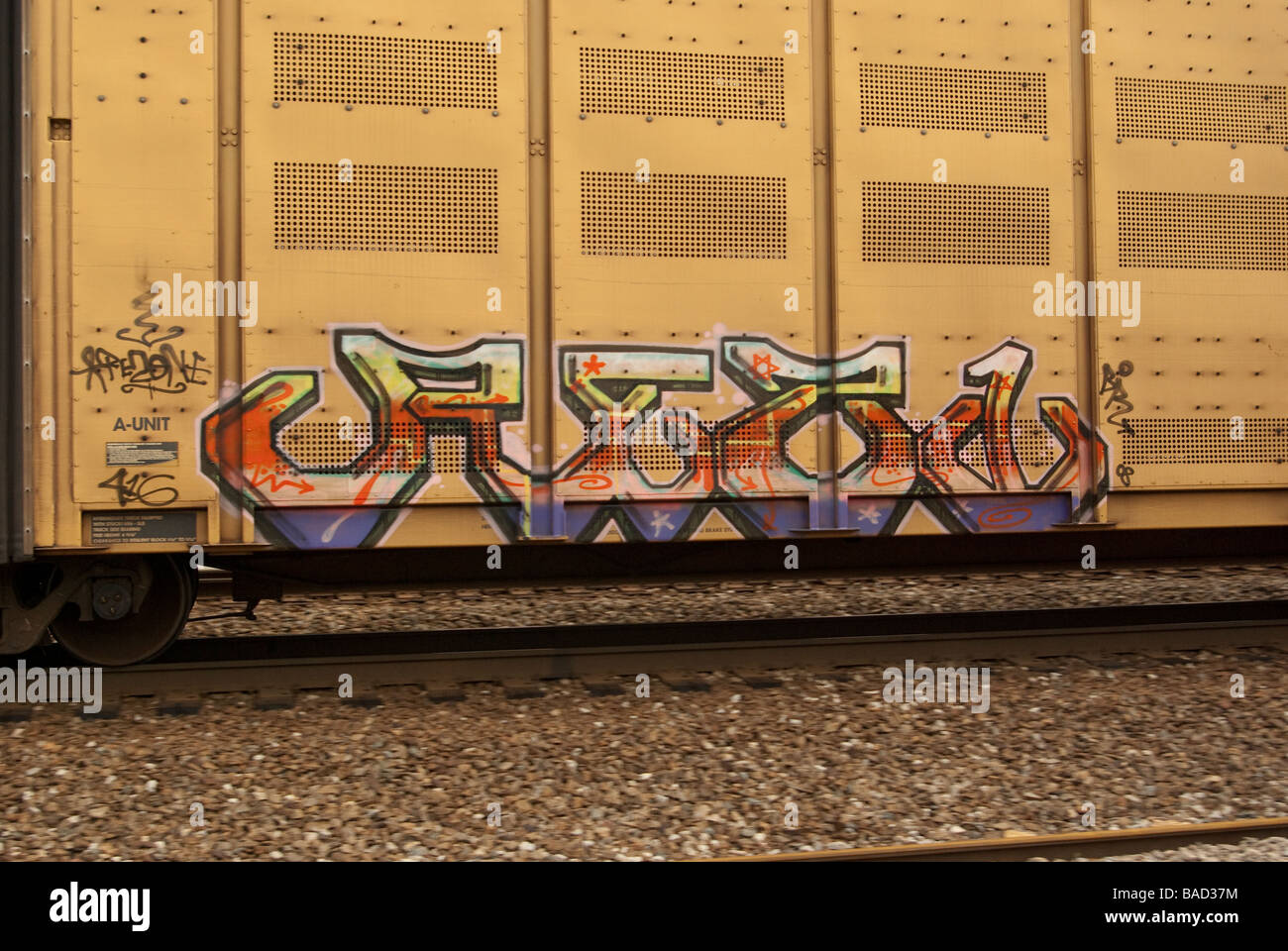 Graffiti on the side of a moving train car Stock Photo - Alamy