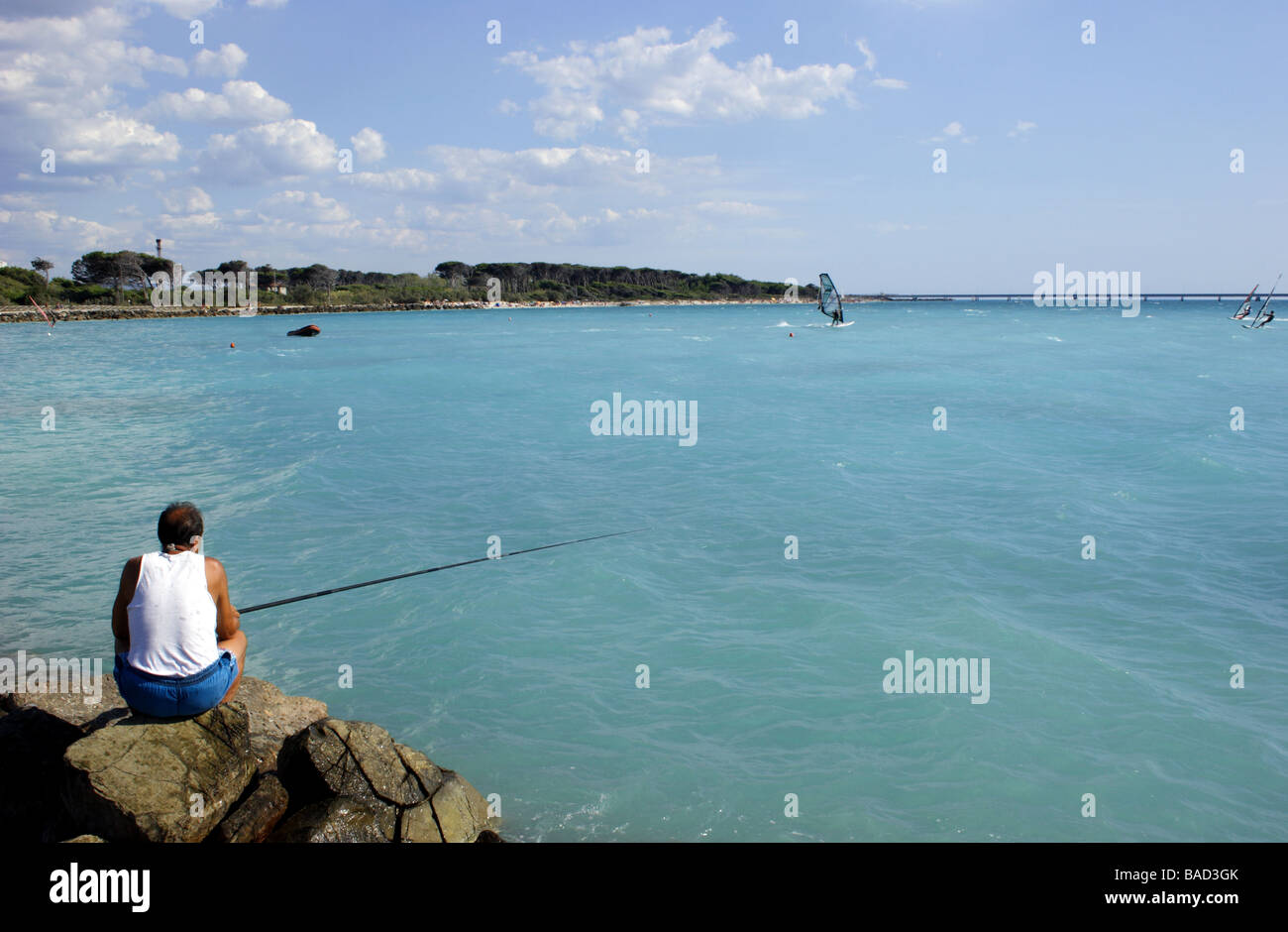 Fishing in White Beach (Vada Stock Photo - Alamy