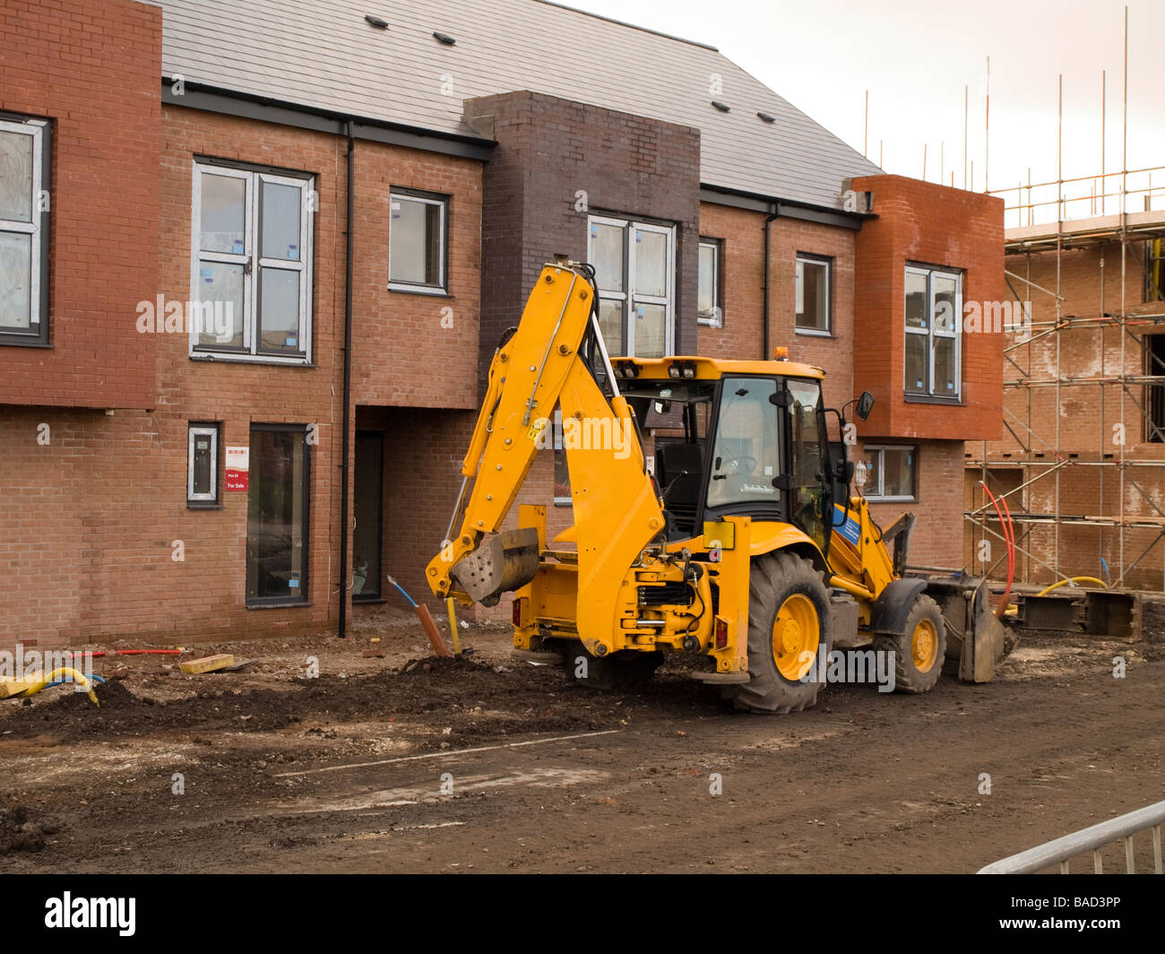 JCB Digger at Construction Site New Build Houses Stock Photo - Alamy