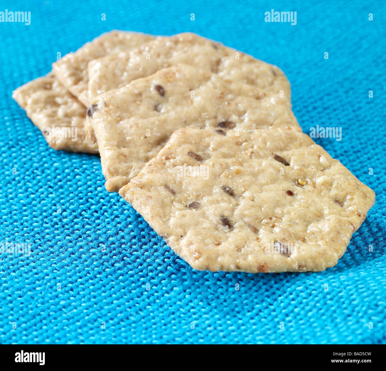 multigrain crackers on blue background Stock Photo - Alamy