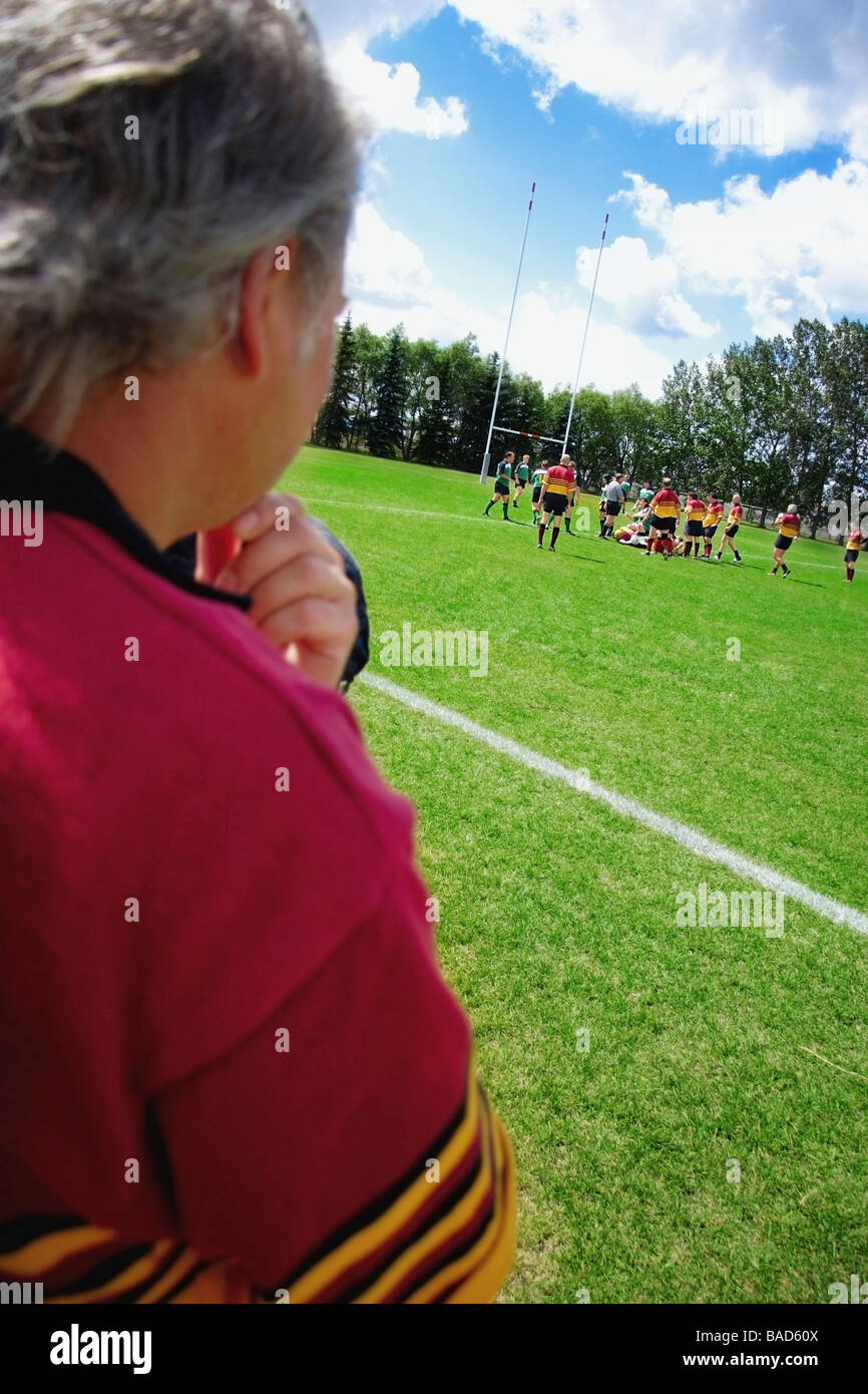 Soccer coach watching a game Stock Photo - Alamy