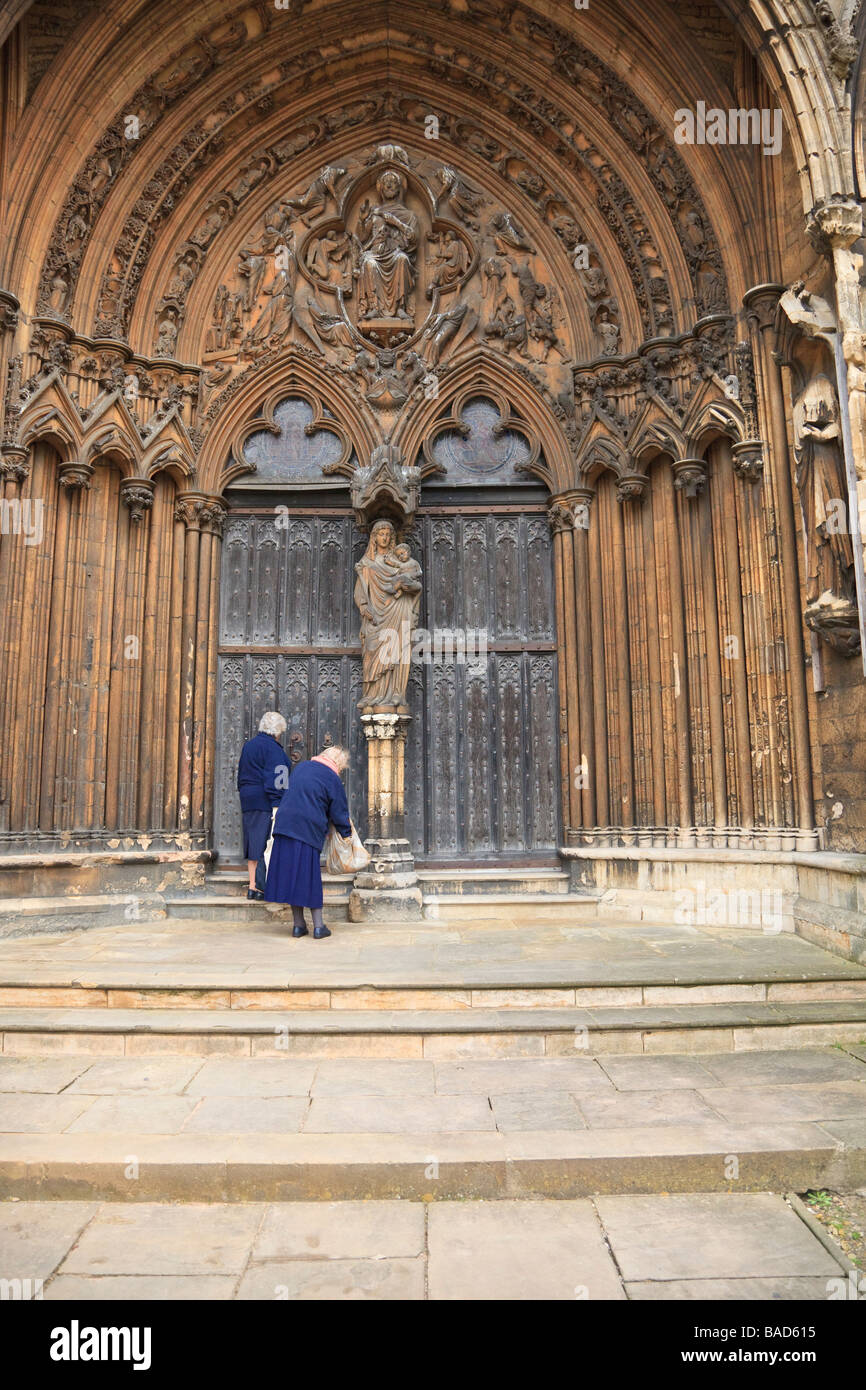 Two Helpers at Lincoln Cathedral enter Through the side entrance Stock ...