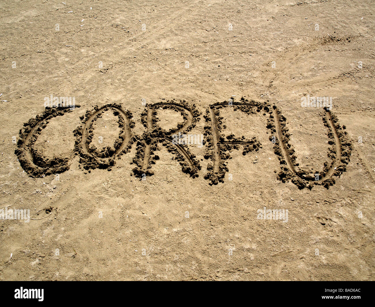 Corfu written in sand Stock Photo - Alamy
