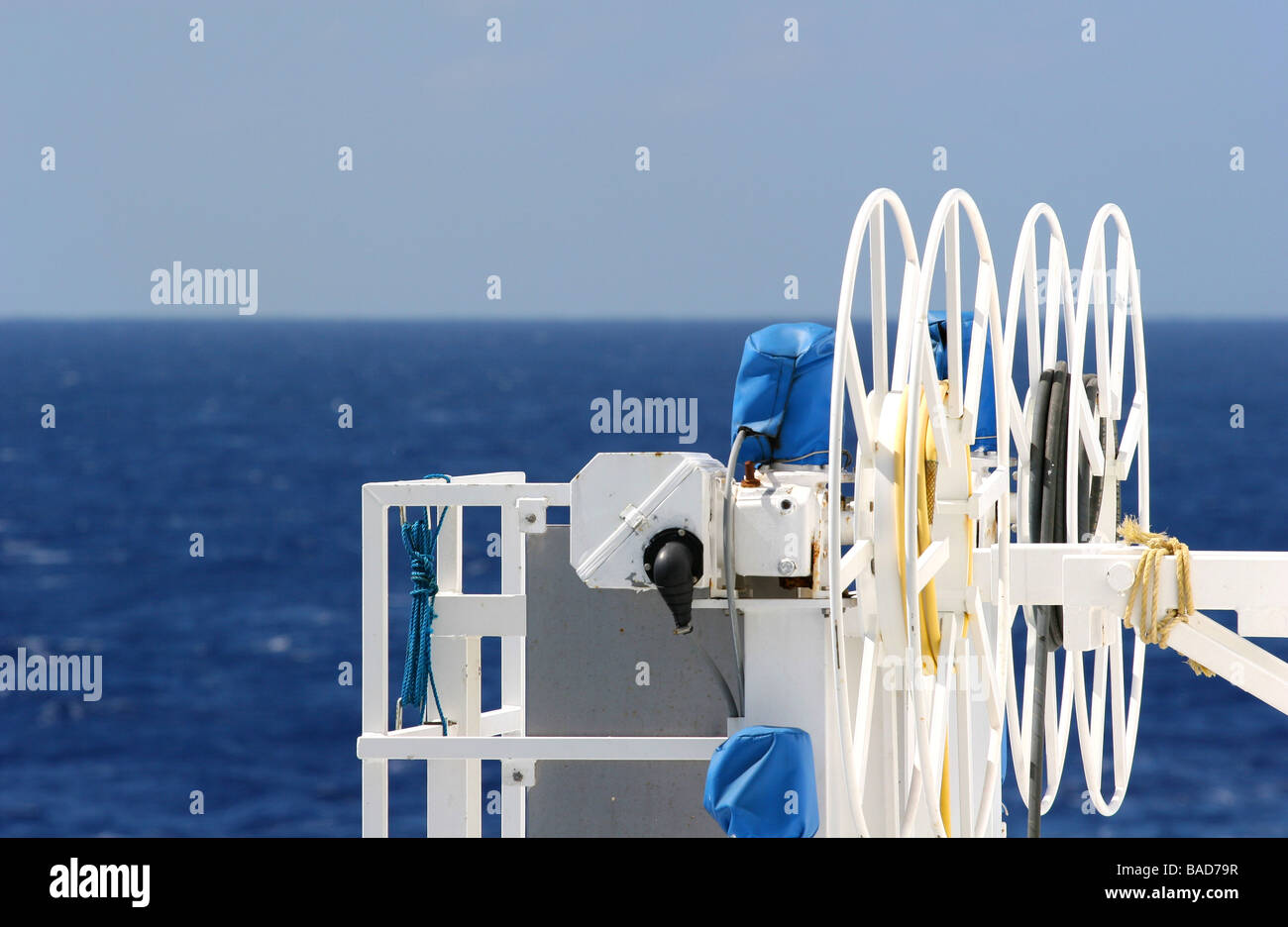 White reels for a moving ramp on a ship Stock Photo - Alamy