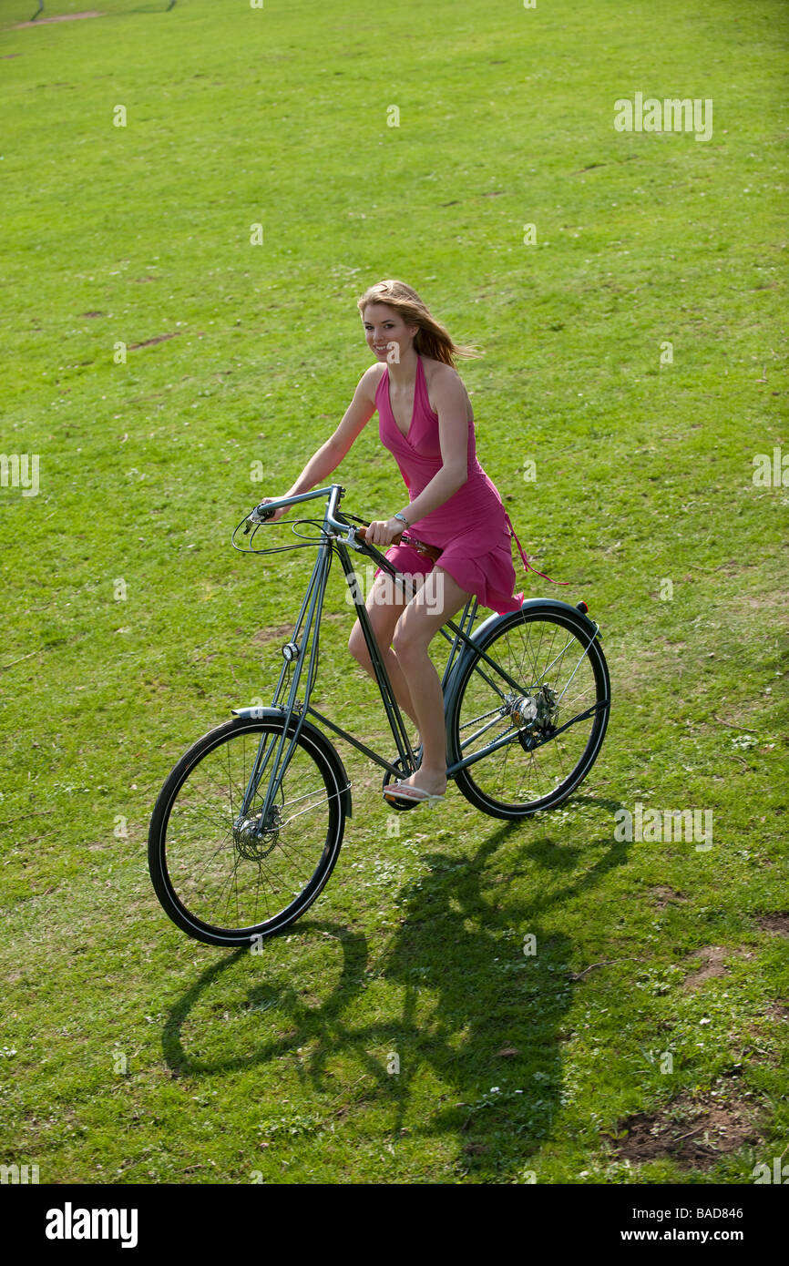 Girl with dress riding bike hi-res stock photography and images - Alamy