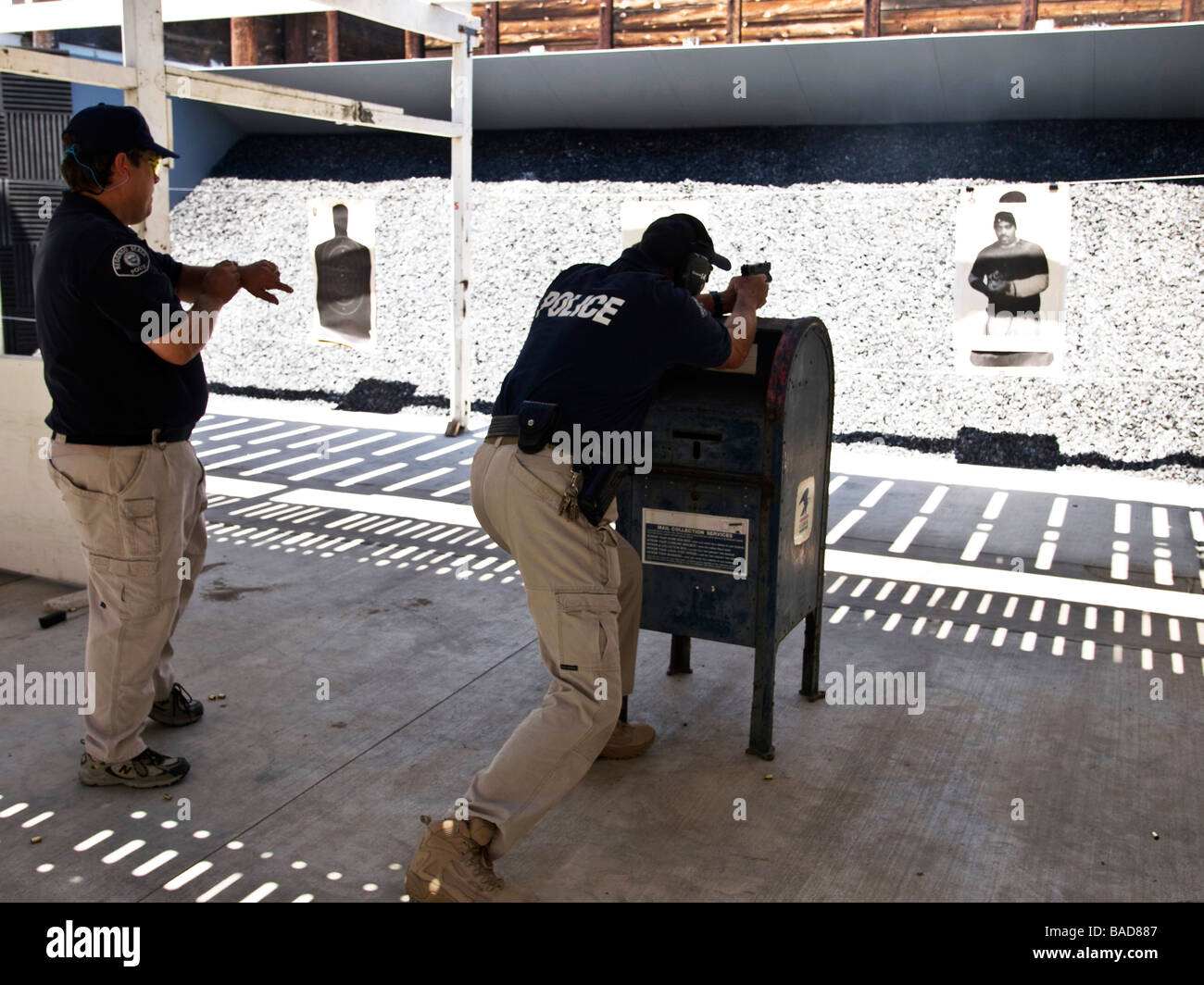 Range officers demonstrate a qualification timed drill shooting various ...