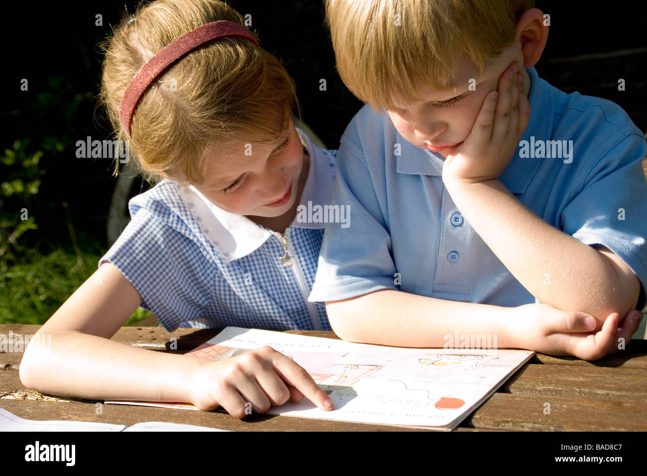 school children learning to read Stock Photo - Alamy