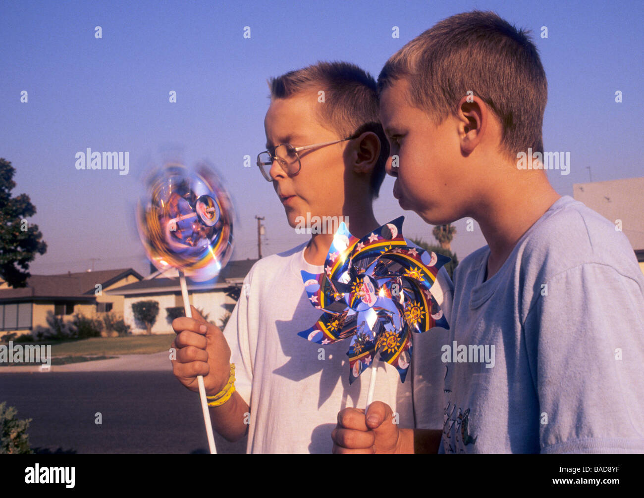 Pinwheel toy boy blow spin color fun enjoy Stock Photo - Alamy