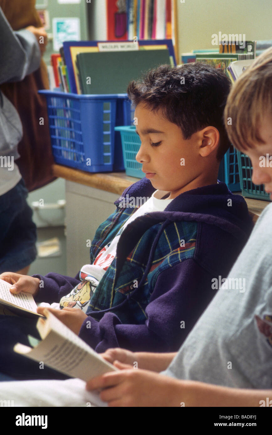 Boy junior high school read school work Stock Photo - Alamy