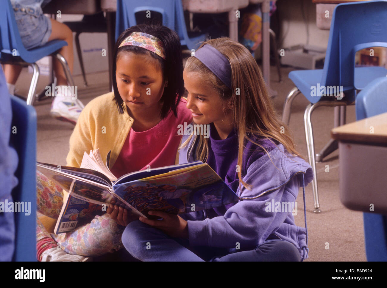 girl read school book share Stock Photo - Alamy