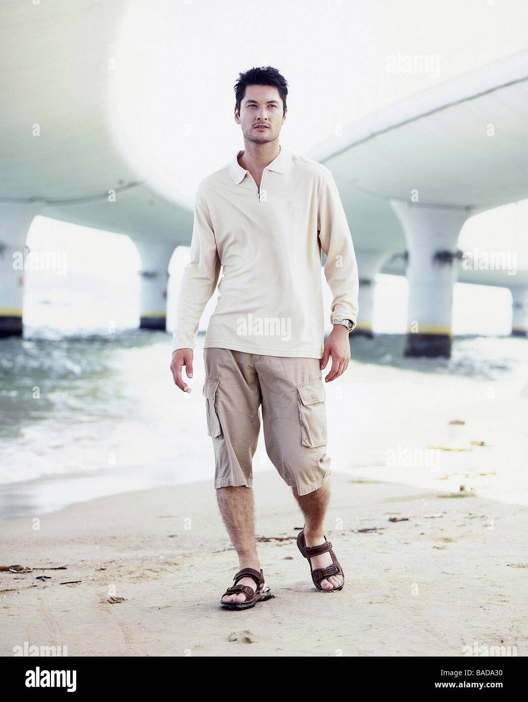 Man on beach Stock Photo - Alamy