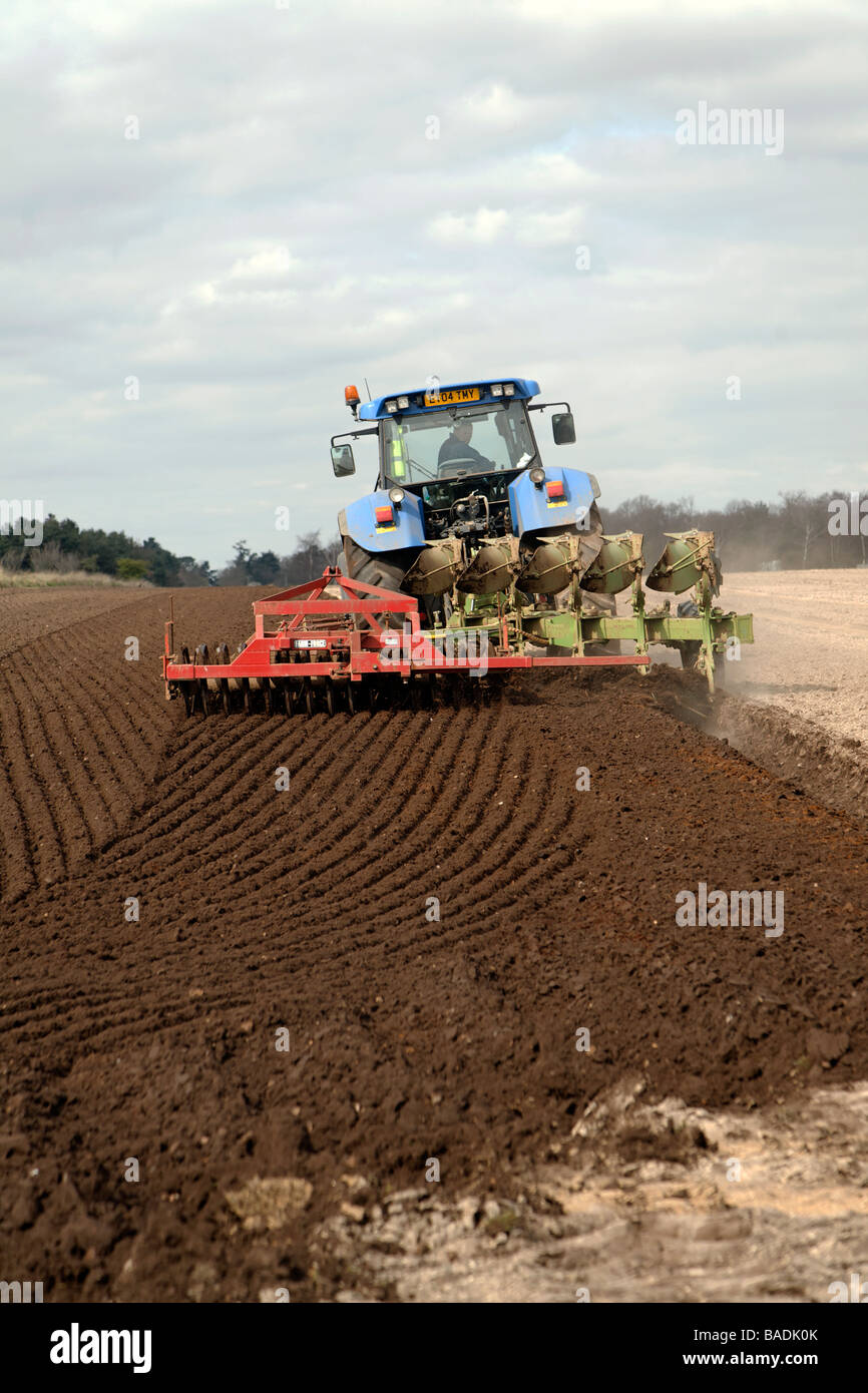 New Holland tractor ploughing field, Sutton, Suffolk, England Stock ...