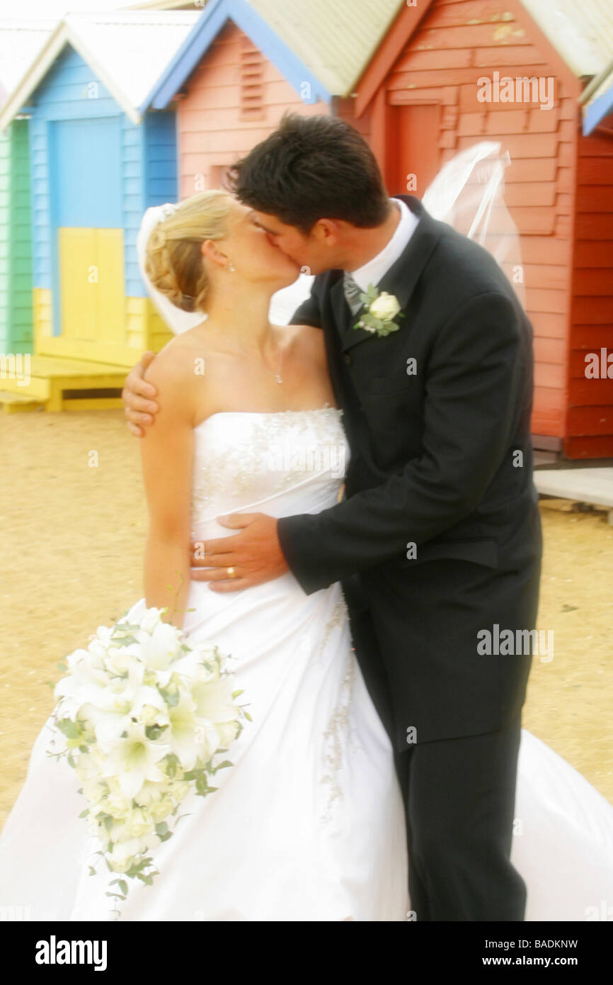 Kissing bride and groom Stock Photo - Alamy