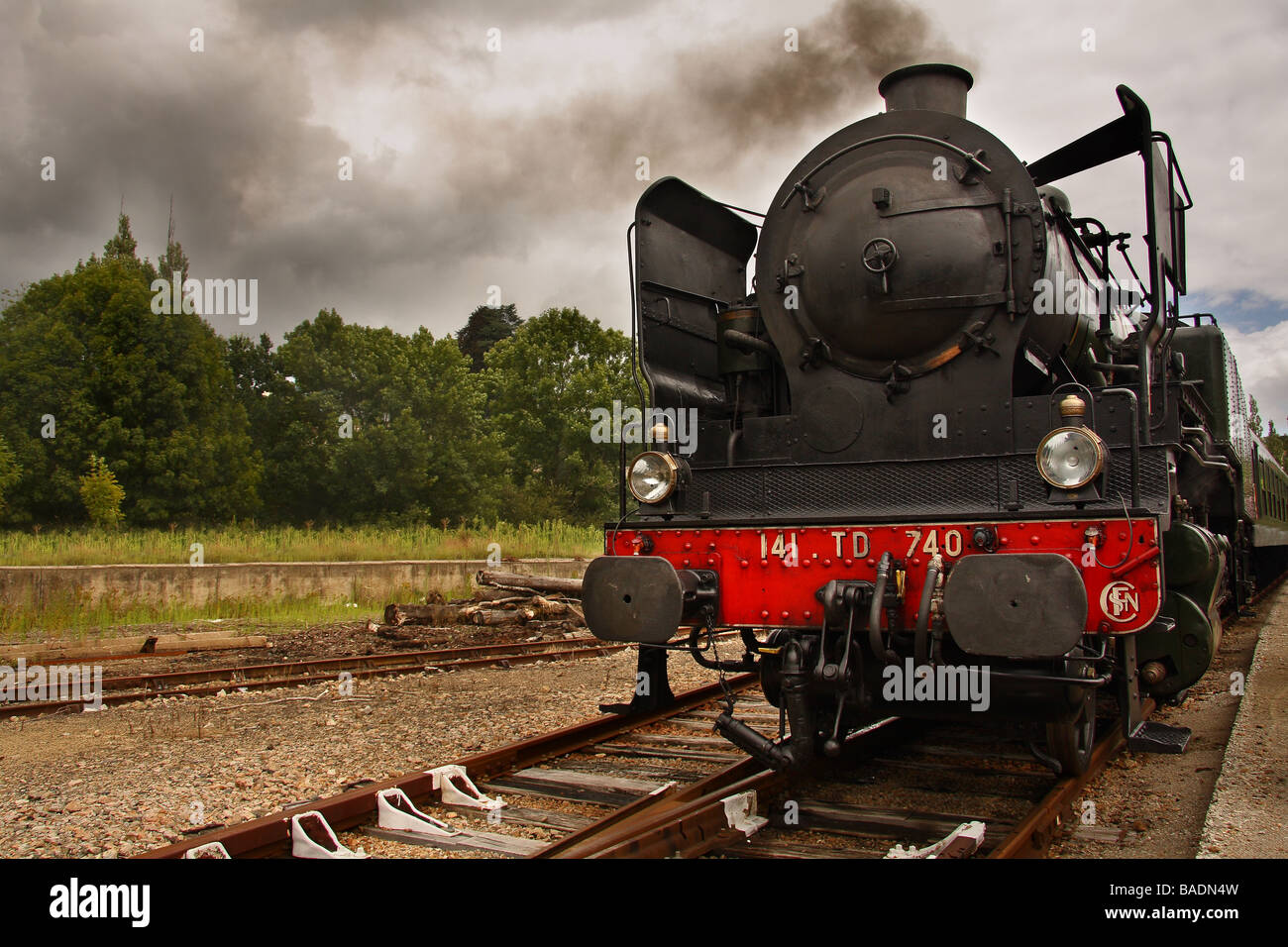 An old SNCF steam train with a carriage of the same period Stock Photo ...