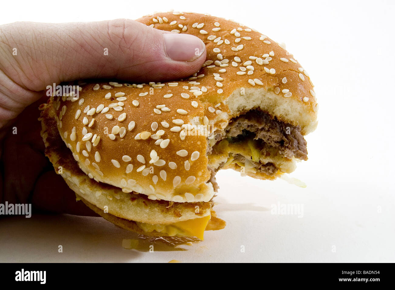 Half eaten burger Stock Photo - Alamy