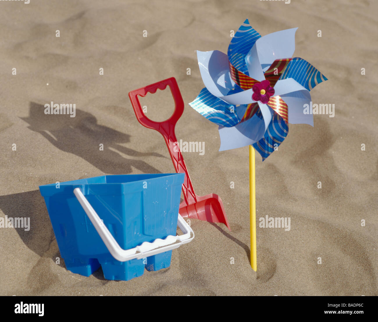 Plastic bucket spade and windmill on a beach Stock Photo - Alamy